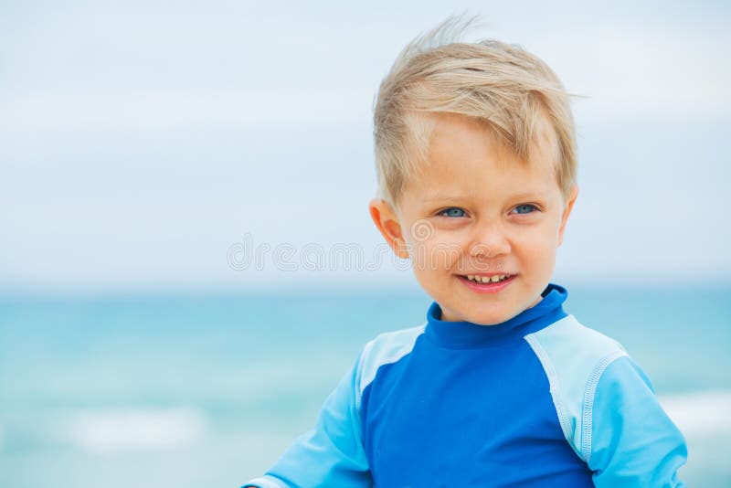 Portrait of Handsome Boy Standing on Beach. Stock Image - Image of blue ...