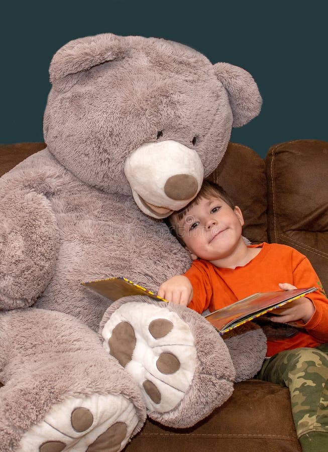 Boy and bear cuddle time stock image. Image of rest - 170252575