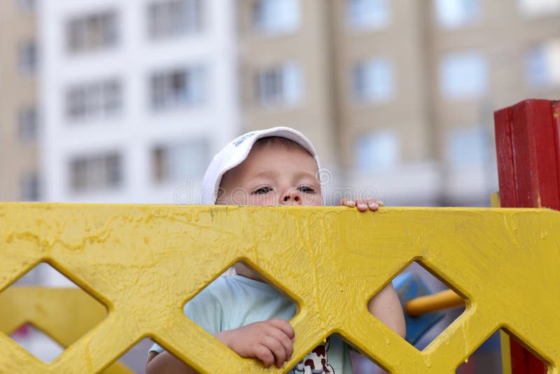 Boy behind fence stock image. Image of park, play, outdoors - 19959985