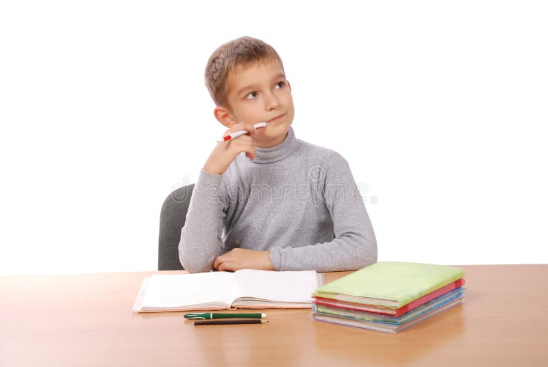Boy Behind a Table Reads the Book Stock Image - Image of child, white ...