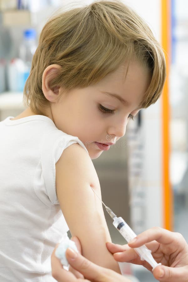 Boy Being Injected at Clinic Stock Image - Image of help, cabinet ...