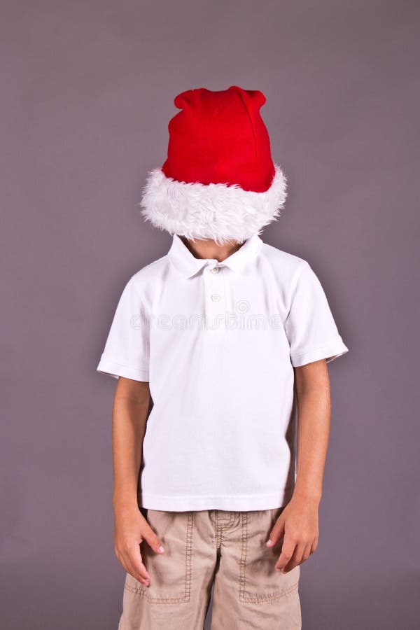 Boy Being Silly with Santa Hat during Christmas Stock Image - Image of ...
