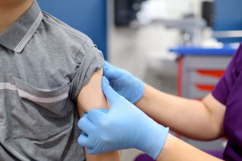 A Boy is Being Vaccinated. a Child is Given a Vaccine during an ... A Boy is Being Vaccinated. a Child is Given a Vaccine during an ...