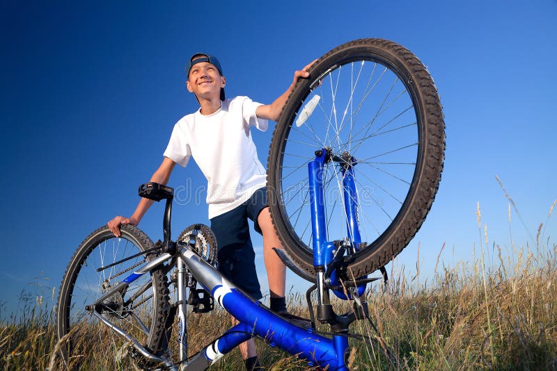The boy with a bicycle stock photo. Image of cycling - 19843982