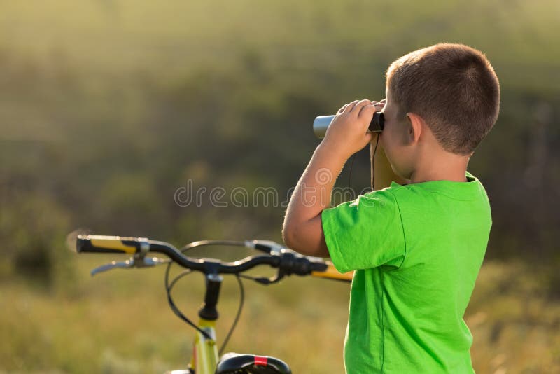 Boy with a Bicycle in Nature, Looking into the Distance through ...