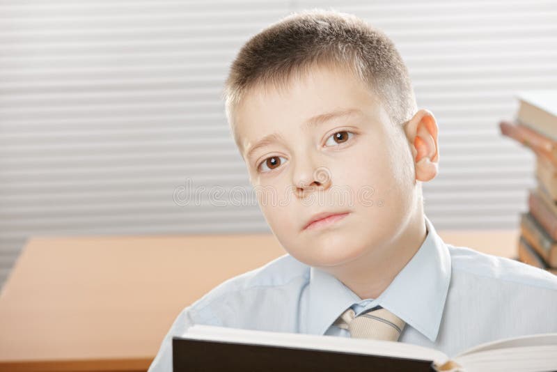 Boy with big book stock image. Image of shirt, books - 26480019