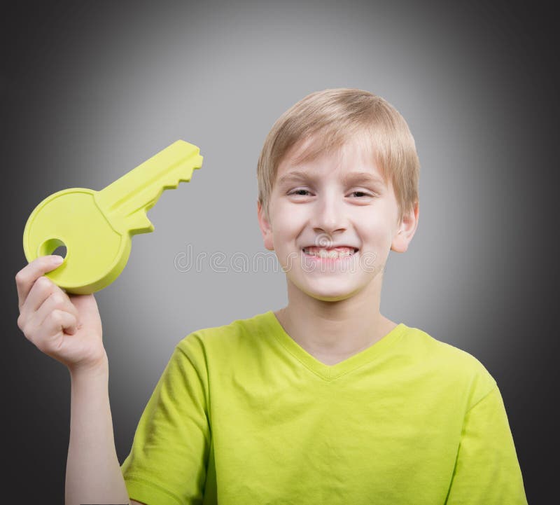 Boy with a big key stock image. Image of childhood, happy - 49130085