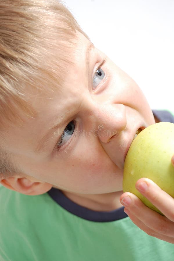 Boy biting an apple stock photo. Image of apple, eating - 11921658