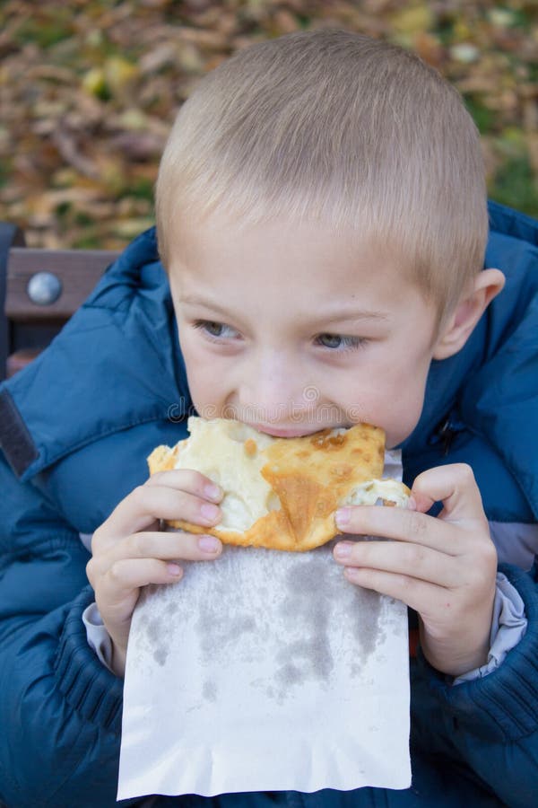 Boy biting food stock image. Image of pizza, cute, baby - 72738647