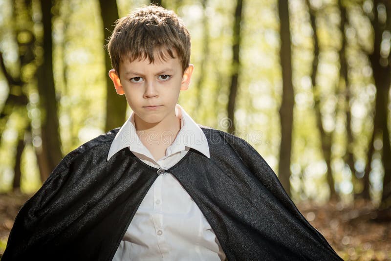 Boy with black cape stock photo. Image of forest, fashion - 53062794