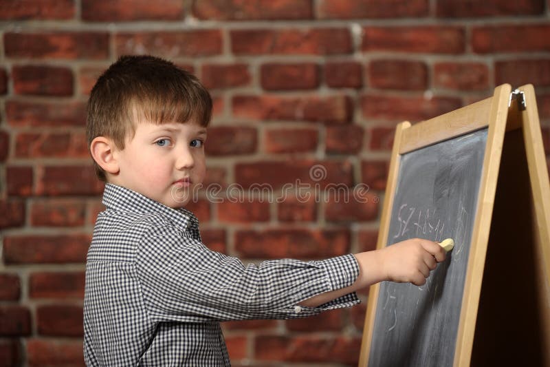 Boy at the blackboard stock photo. Image of male, childhood - 27732116
