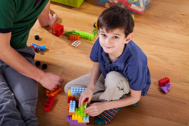 A Boy with Blocks on the Floor Stock Image - Image of entertainment ...