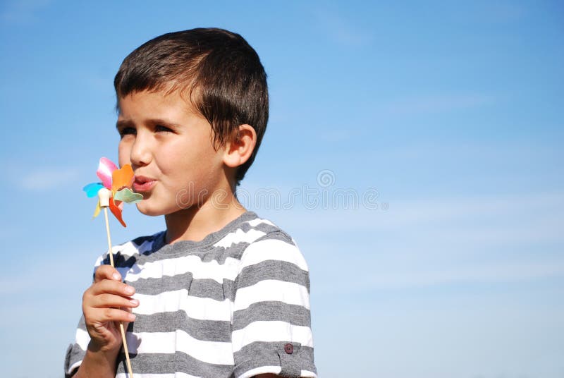 Boy blowing windmill stock image. Image of wind, sunny - 10726355 Boy blowing windmill stock image. Image of wind, sunny - 10726355