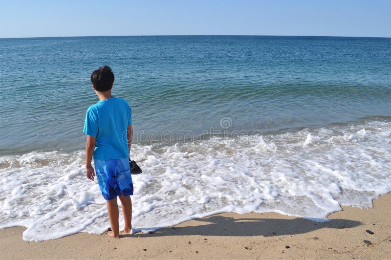 Boy at the Blue Beach stock image. Image of foam, blue - 28390425