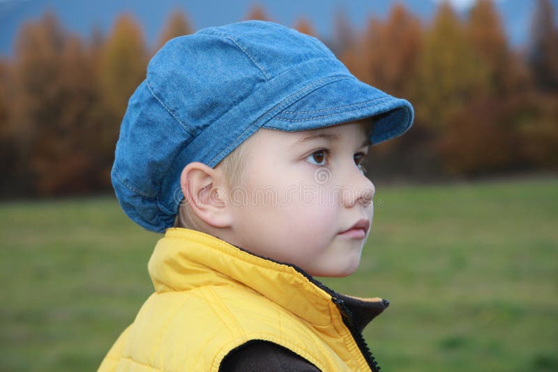 Boy with blue cap stock photo. Image of meadow, baby, children - 7168190