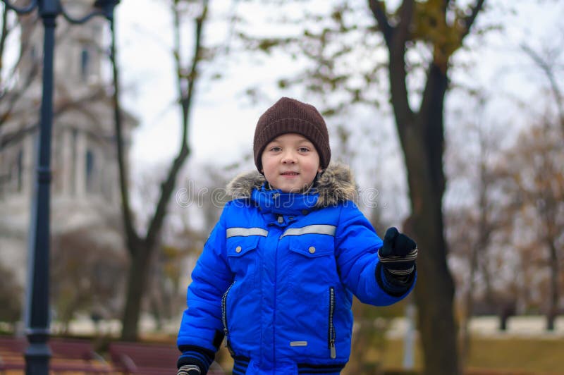 Boy in a Blue Jacket Running in the Park Stock Image - Image of ...