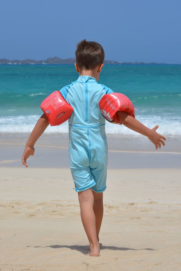 Boy on Blue Onesie on Beach during Day Stock Image - Image of seaside ...