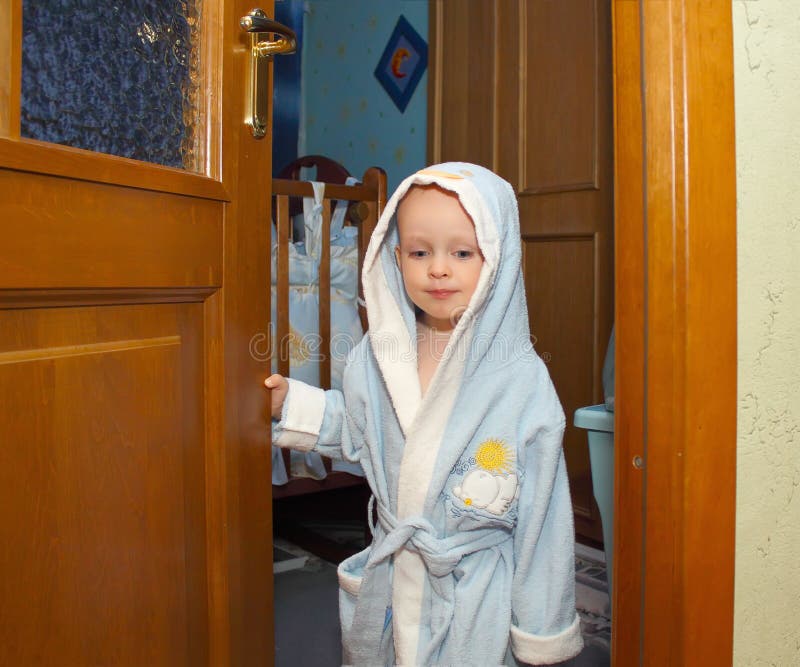 A boy in a blue robe stock photo. Image of night, small - 17743468