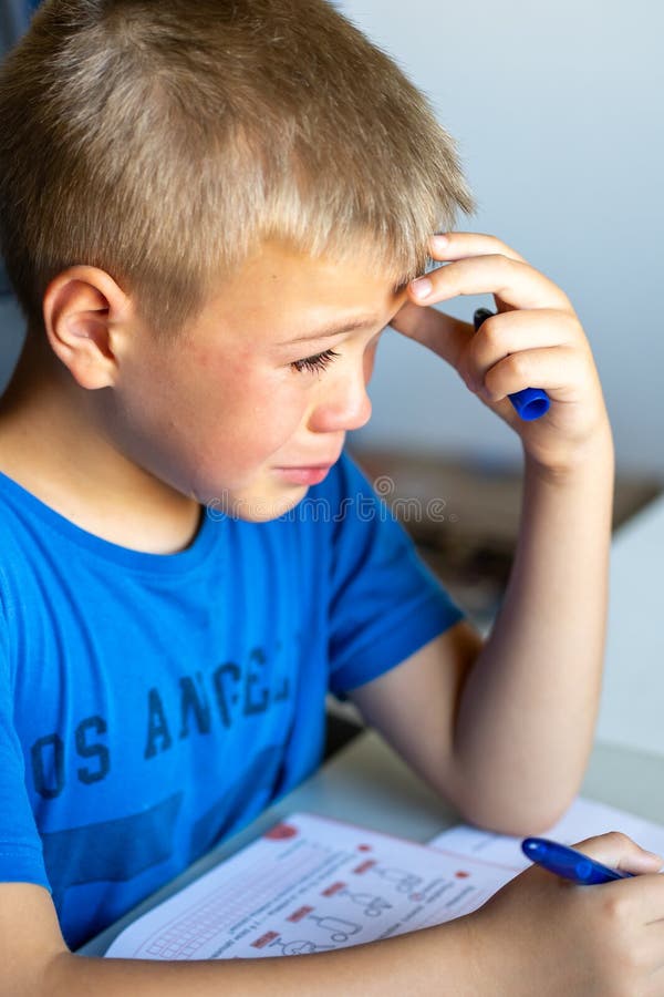 A Boy in a Blue T-shirt is Crying Over School Stock Image - Image of ...