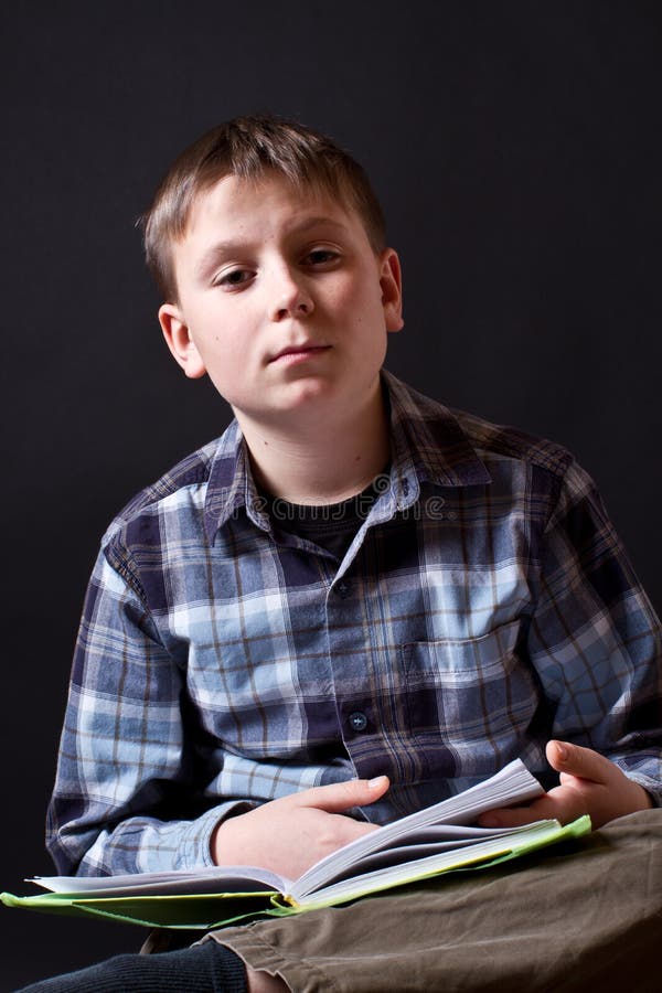 Boy with a book stock photo. Image of lesson, graduate - 28230884