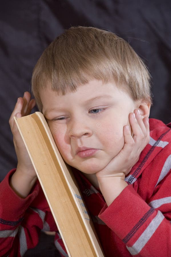 Boy with a book stock photo. Image of long, examine, book - 7881010