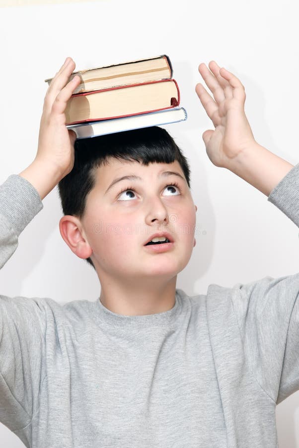 Boy with a Book on His Head Stock Photo - Image of emotion, portrait ...