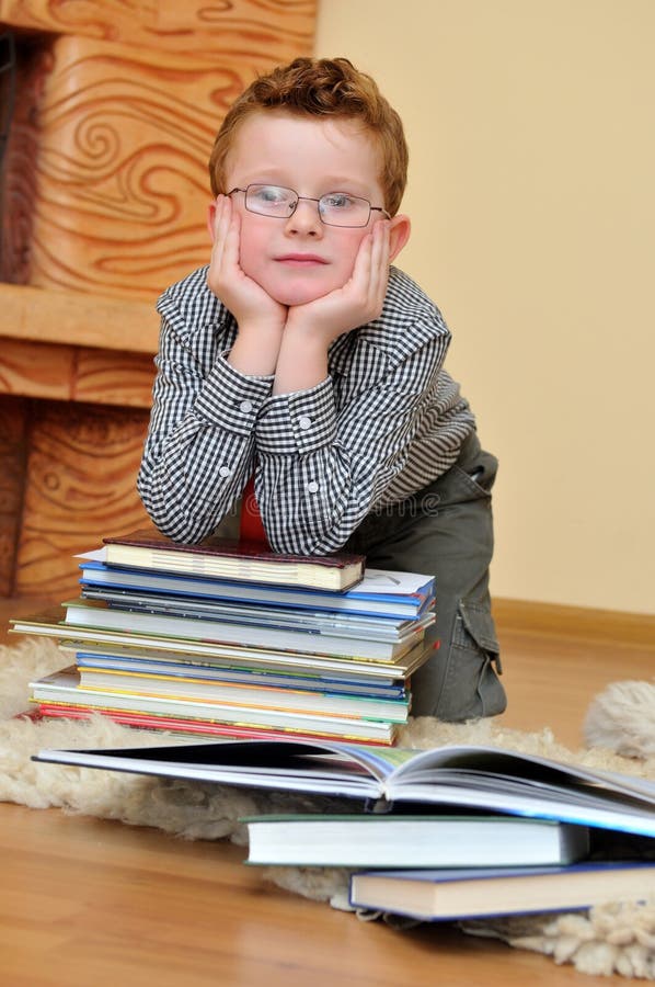 Boy with books stock photo. Image of intellectual, home - 22227268