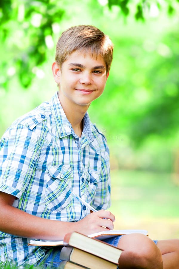 Boy with books stock image. Image of green, schoolchild - 33673801