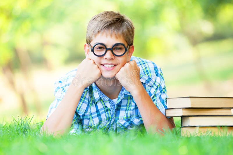 Boy with books stock photo. Image of lawn, child, portrait - 33684964