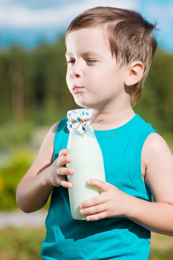 Boy with Bottle of Milk Says Mooooo Stock Photo - Image of smile ...
