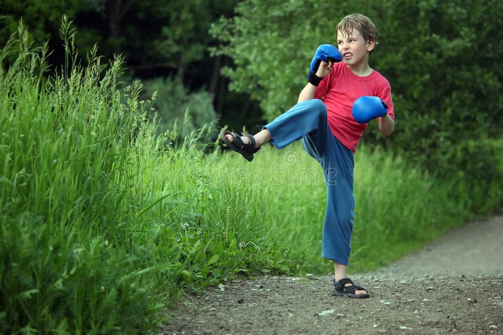 Boy-boxer trains in park stock image. Image of power - 10502983