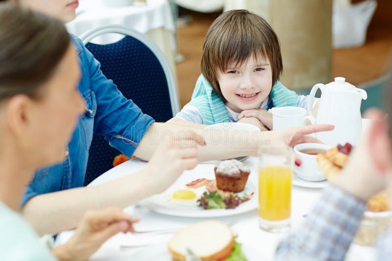 Boy by breakfast stock image. Image of little, cafe, together - 94972451
