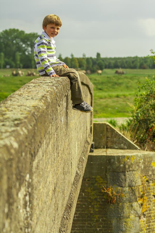 Boy on bridge stock photo. Image of high, green, looking - 27342068