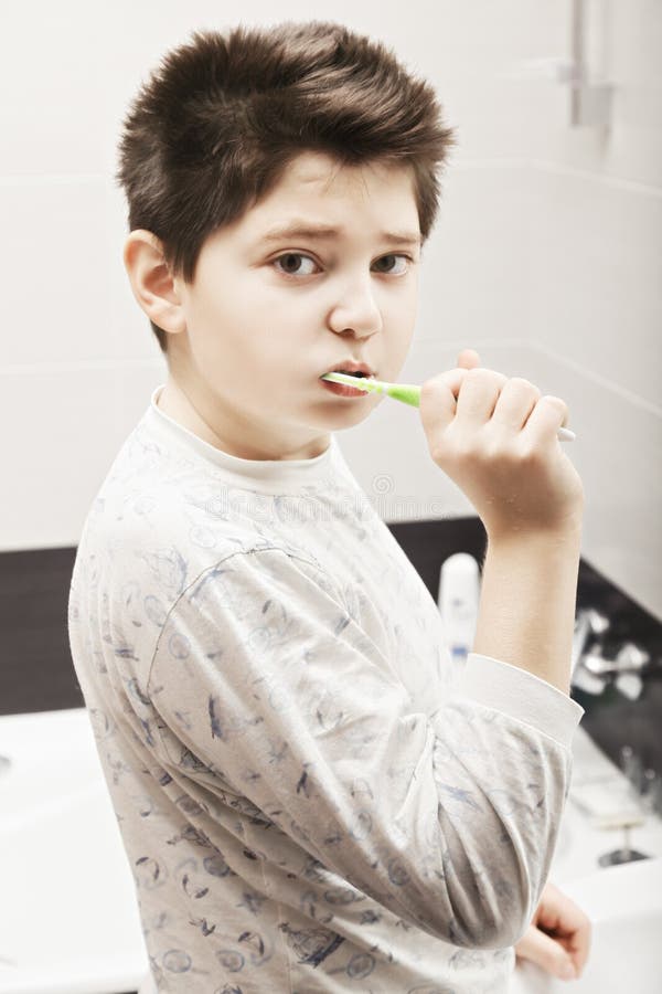 Boy brushing teeth stock photo. Image of horizontal, child - 13462698