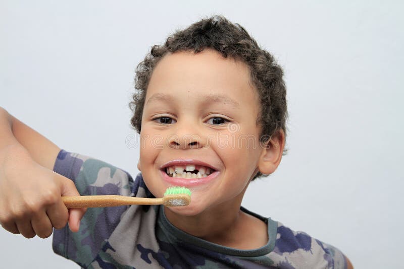Boy Brushing Teeth with an Tooth Brush Stock Photo Stock Image - Image ...