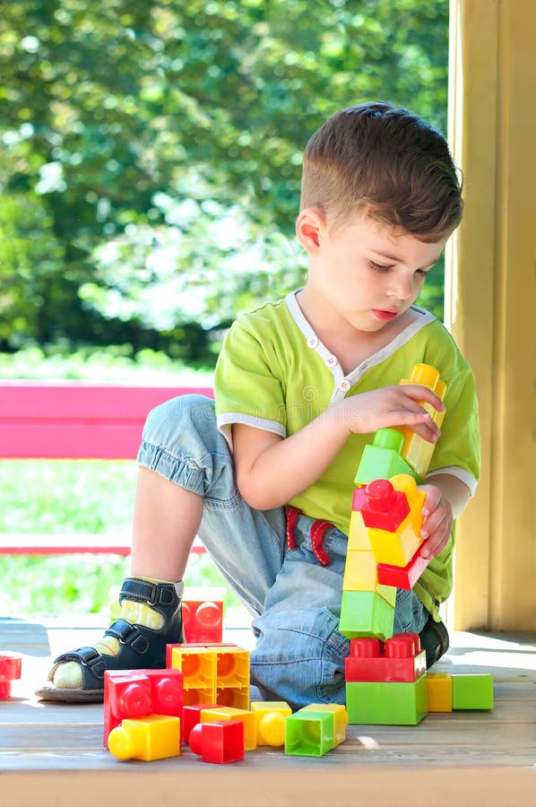 Boy build tower stock image. Image of fragile, light - 56936147