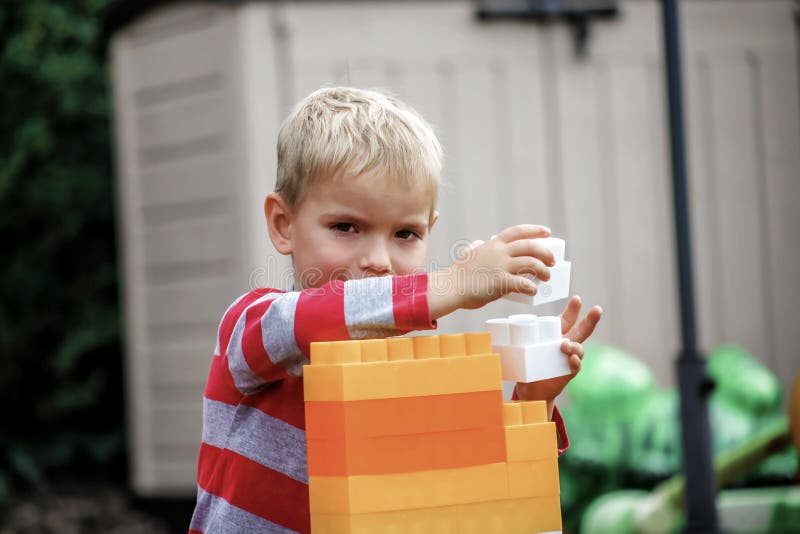 Boy Building Constructor Tower from Plastic Blocks Stock Photo - Image ...