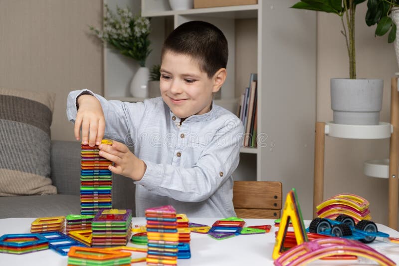 Boy Building a Tower from a Magnetic Construction Set Stock Image ...