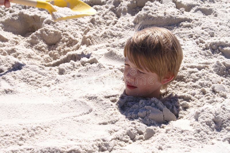 Boy Buried in Sand stock photo. Image of happy, blond - 34002464