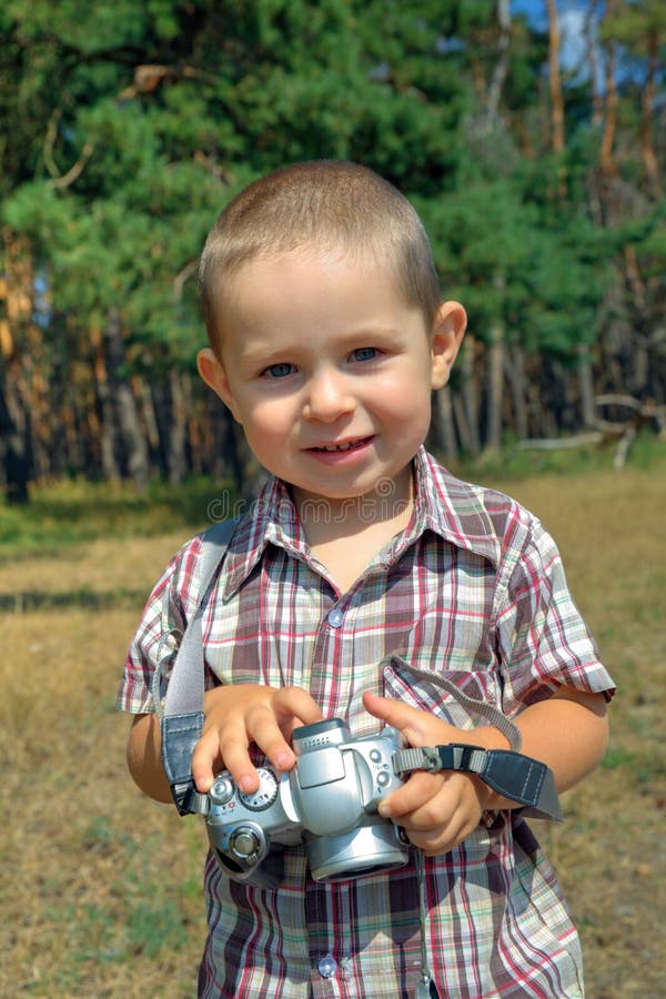 Boy with a camera stock image. Image of outdoors, face - 37564835