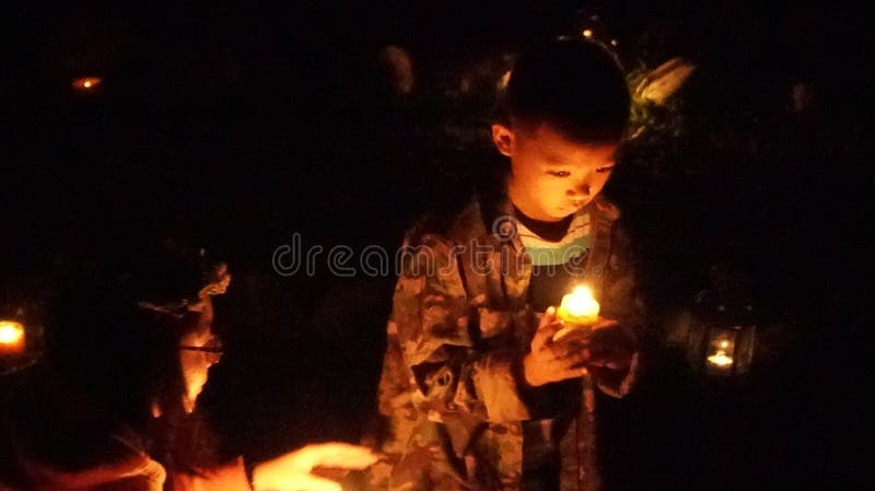Boy in candlelight stock image. Image of candles, evening - 82915185