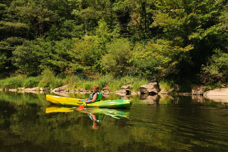 Boy canoeing on river stock photo. Image of stream, kayaking - 21172324