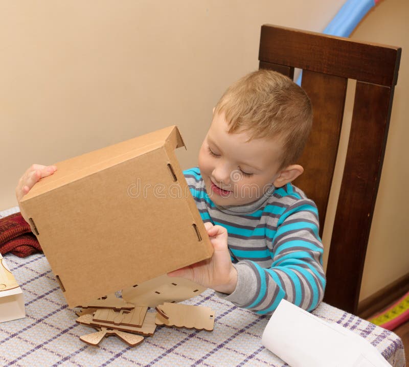 Boy with a cardboard box stock photo. Image of play, happiness - 72721352