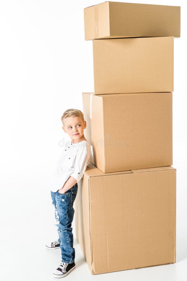 Boy with cardboard boxes stock photo. Image of packing - 125620962