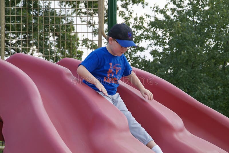 Boy on carnival slide editorial image. Image of life - 188423785