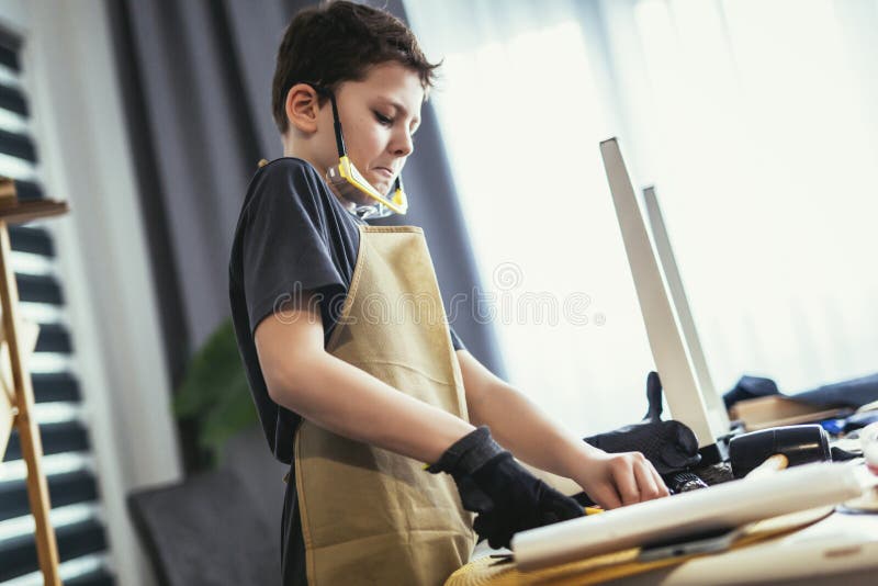 Boy Carpenter Holding and Working with Wooden at Home. Stock Image ...