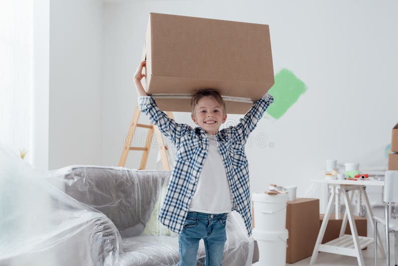 Boy carrying a big box stock photo. Image of carrying - 86802090