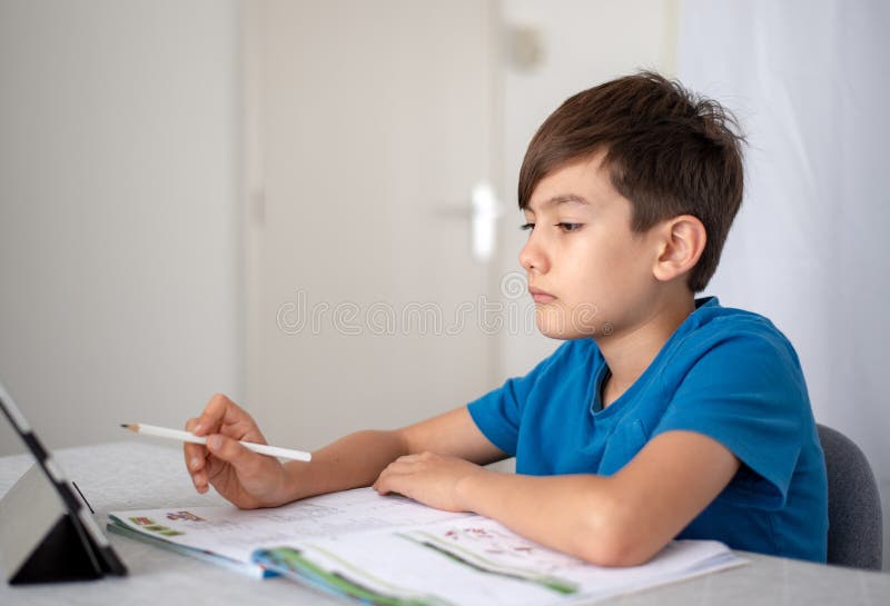A Boy Focusing on Study Alone in the Room Stock Image - Image of ...