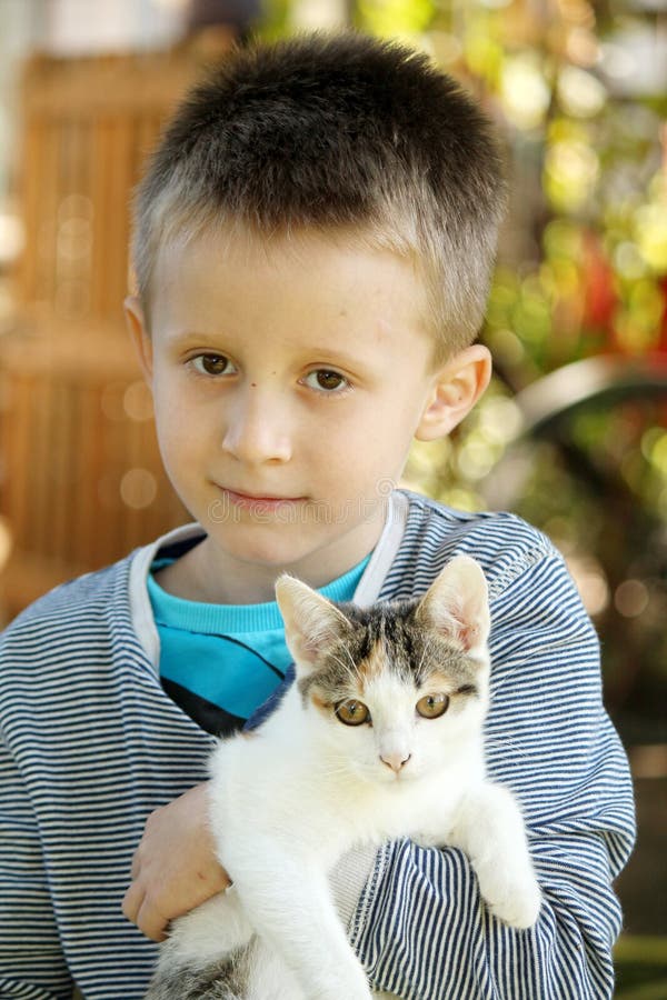 Boy and cat stock image. Image of lovable, cheerful, calm - 46607895