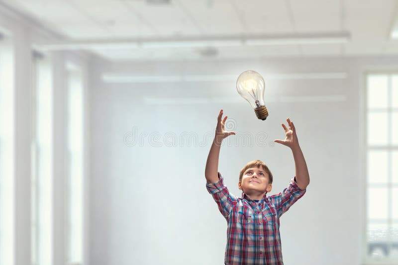 Boy Catch Light Bulb. Mixed Media Stock Photo - Image of idea, baby ...